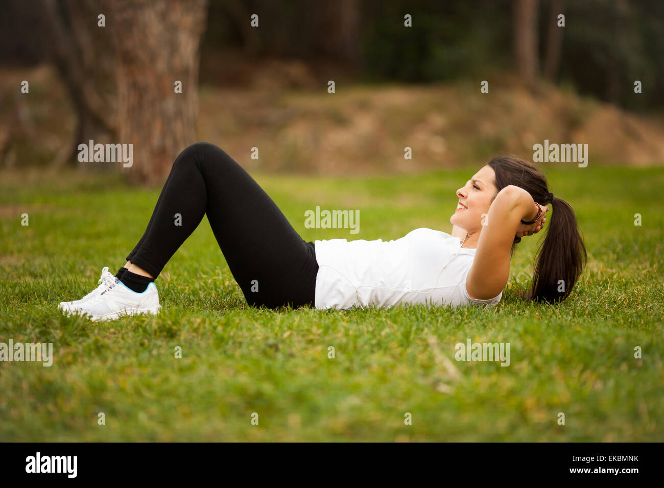 young beautiful latin woman making abs Stock Photo - Alamy