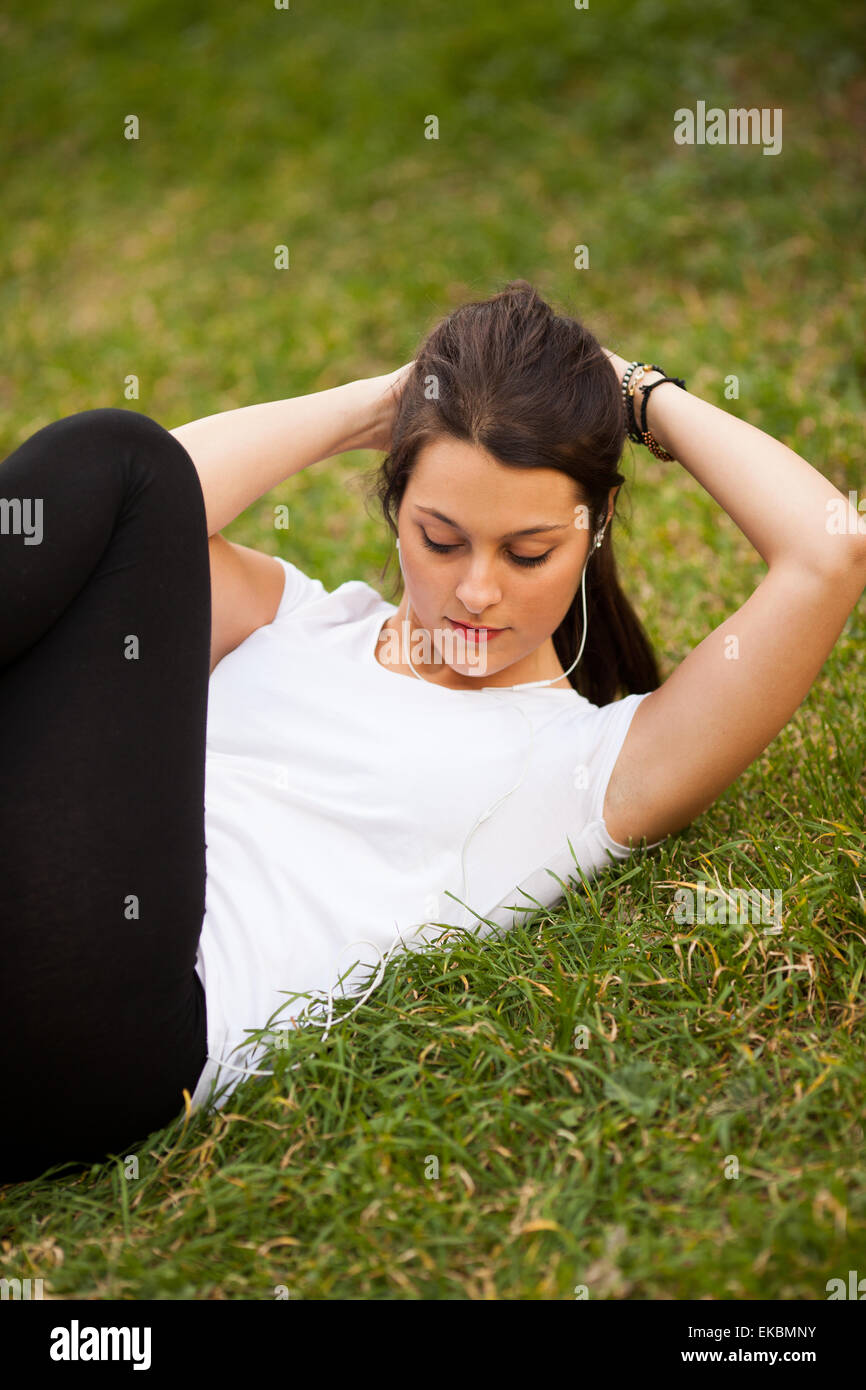 young beautiful latin woman making abs Stock Photo - Alamy