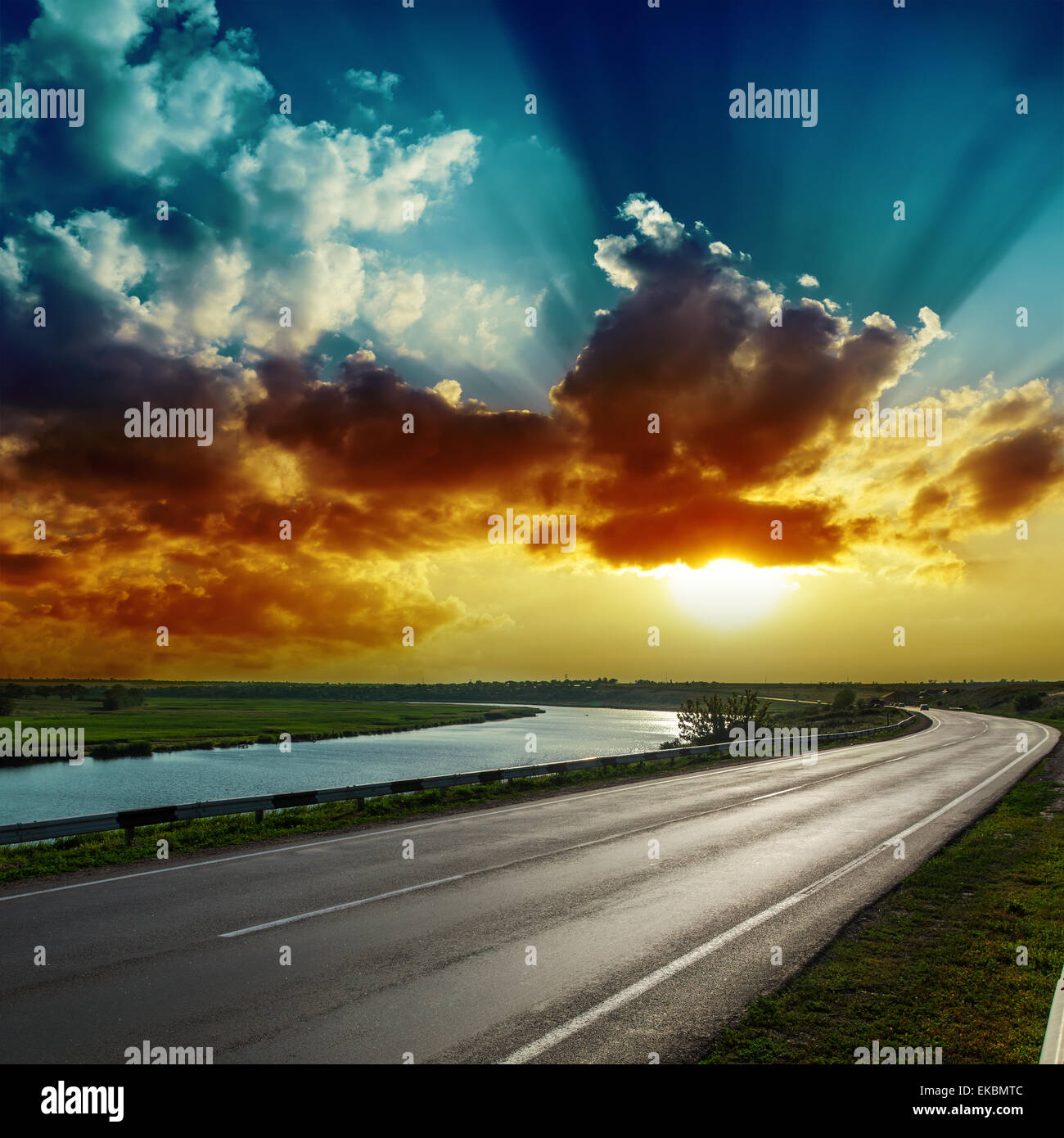 fantastic dramatic sunset over asphalt road Stock Photo - Alamy