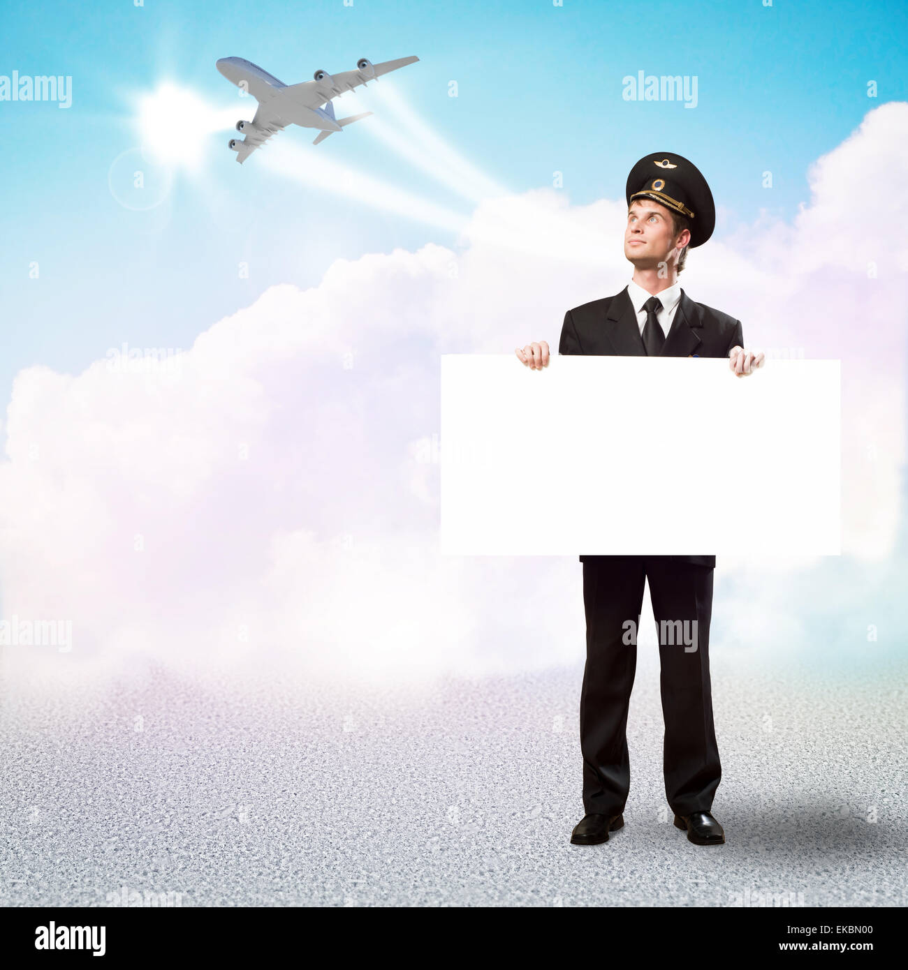 pilot in the form of holding an empty billboard Stock Photo - Alamy