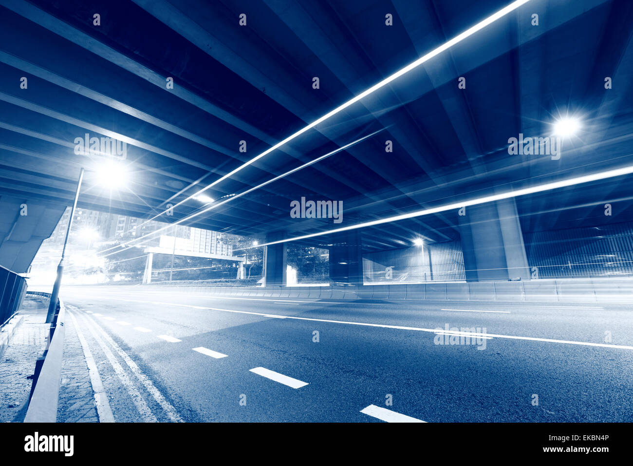 traffic light through city at night in blue tone Stock Photo - Alamy