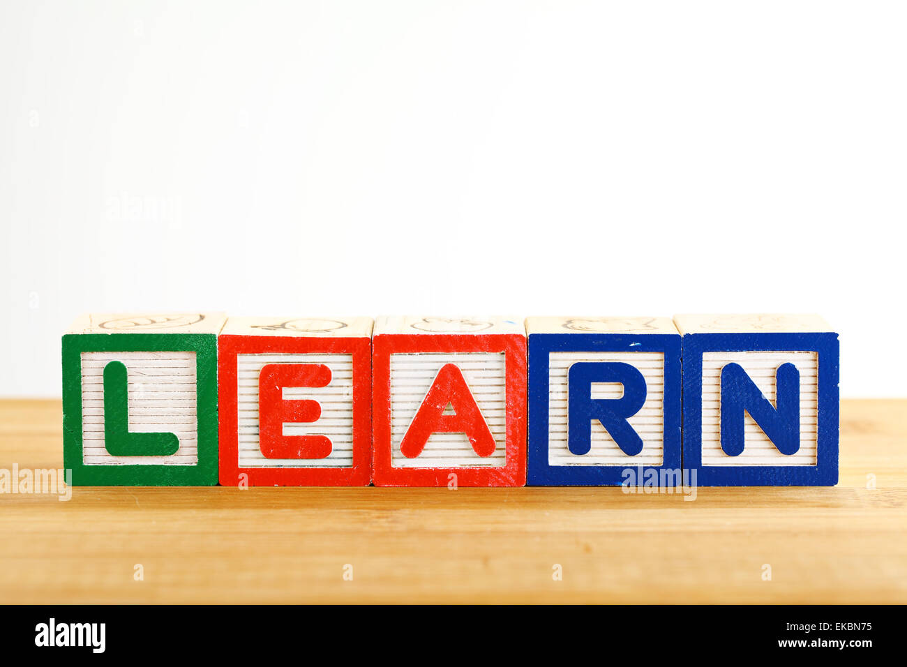Alphabet Block spell the word learn Stock Photo - Alamy