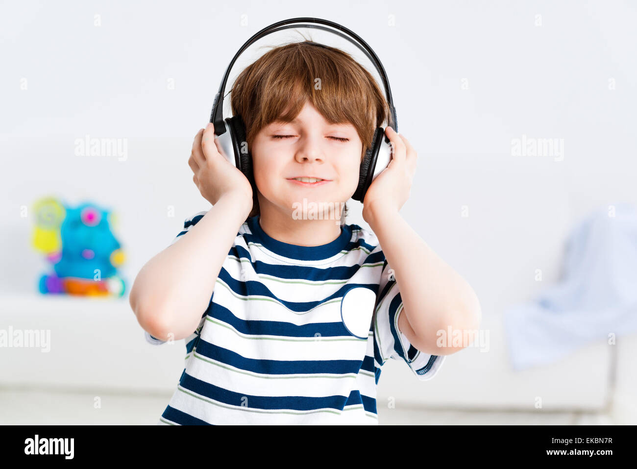 Boy listening to music Stock Photo - Alamy