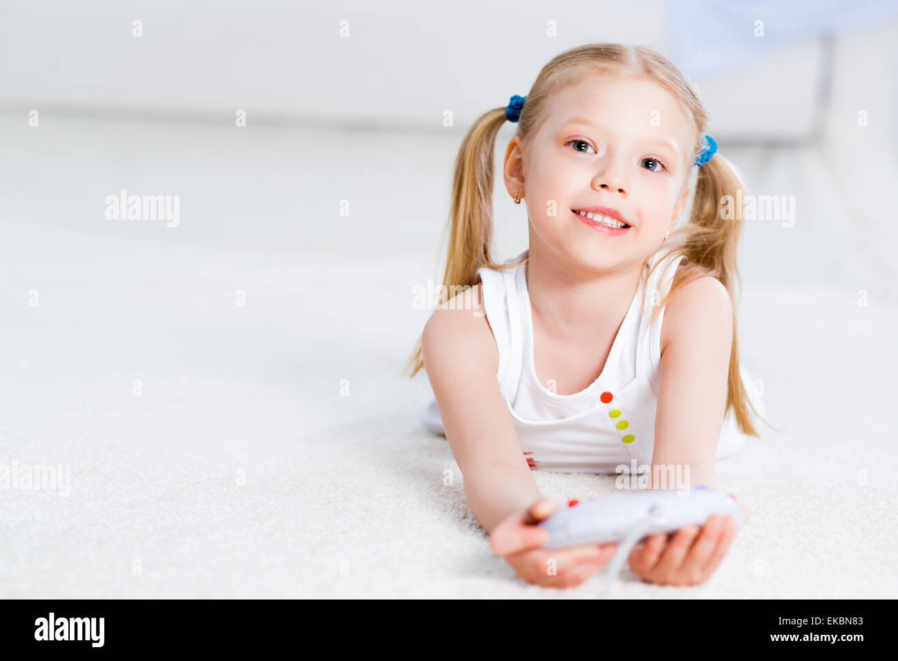 girl playing on a game console Stock Photo - Alamy