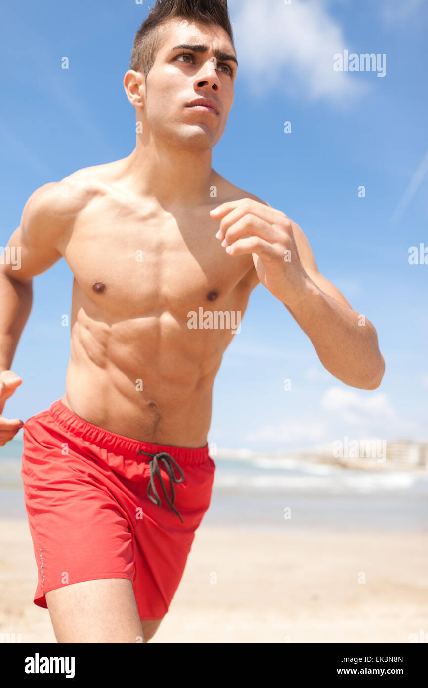 young handsome man jogging Stock Photo - Alamy