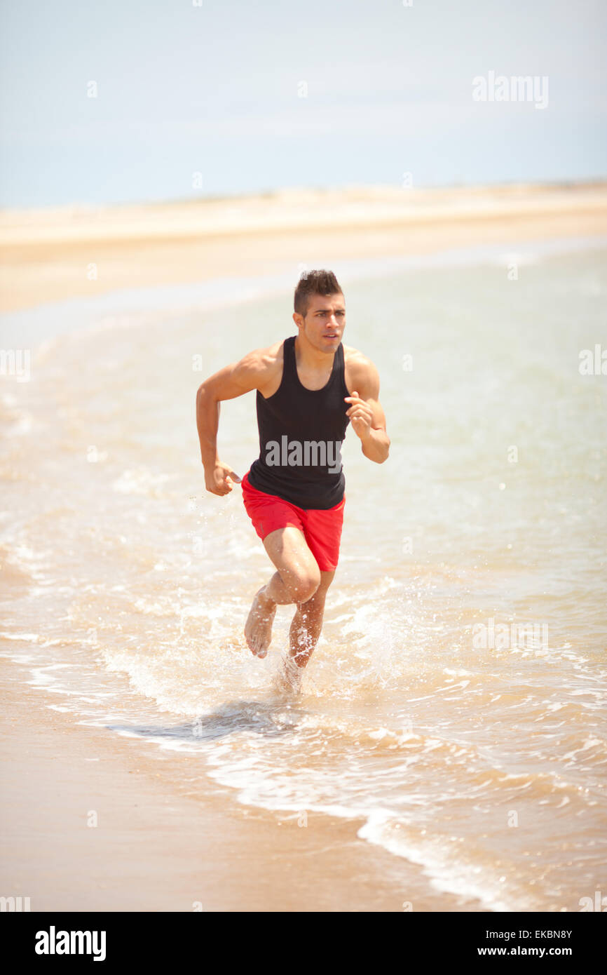 Man jogging beach hi-res stock photography and images - Alamy