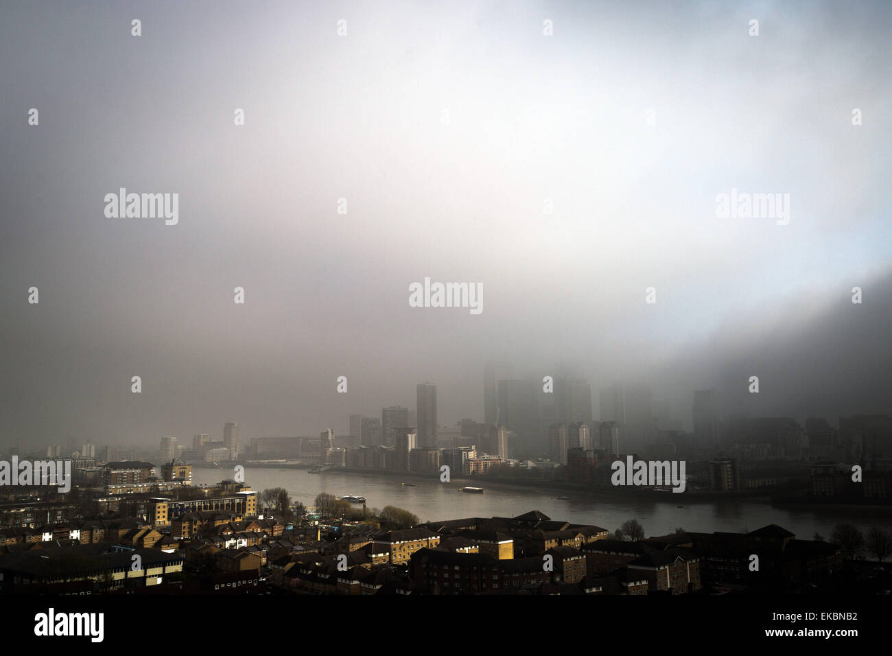 London, UK. 9th April, 2015. Heavy Morning Fog over Canary Wharf ...