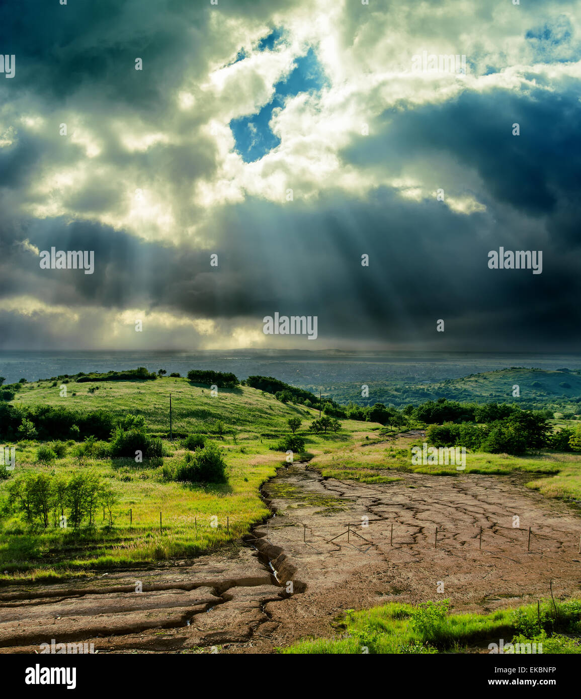 dramatic sky over drought earth Stock Photo - Alamy