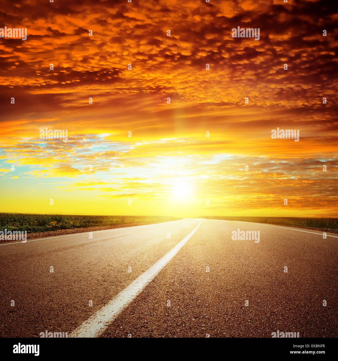 red dramatic sunset over asphalt road Stock Photo - Alamy
