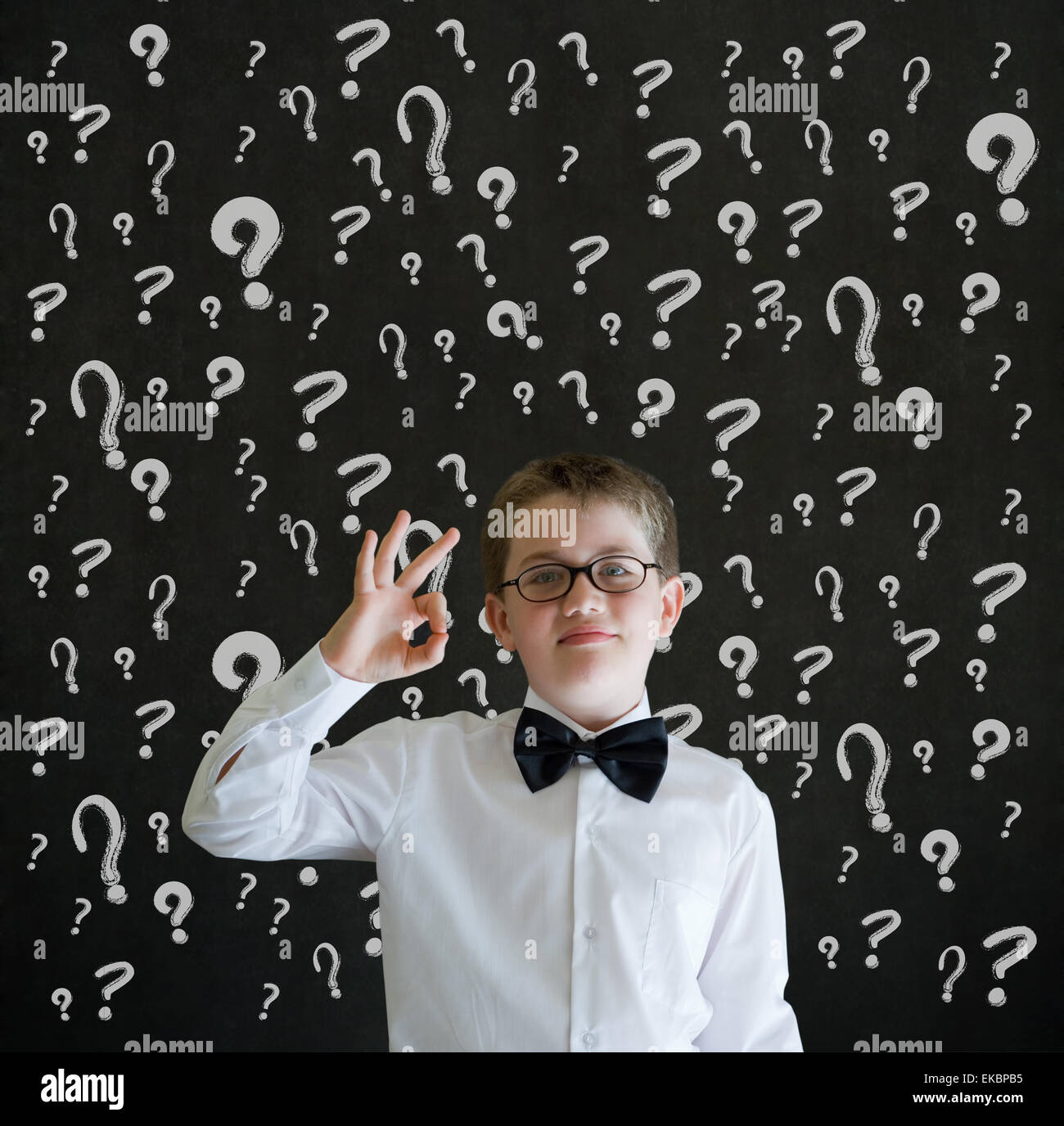 All ok boy dressed as business man with chalk question marks Stock ...