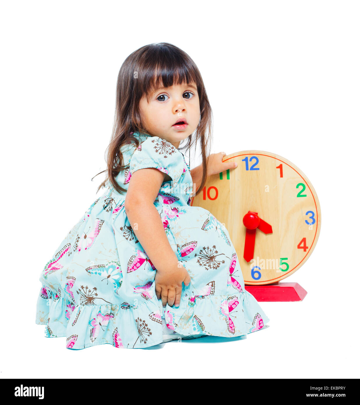 Pretty little girl with clock Stock Photo - Alamy