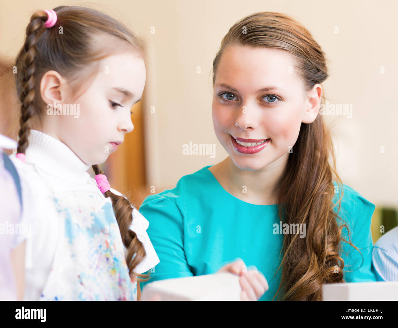 Teacher classroom helping teen hi-res stock photography and images - Alamy