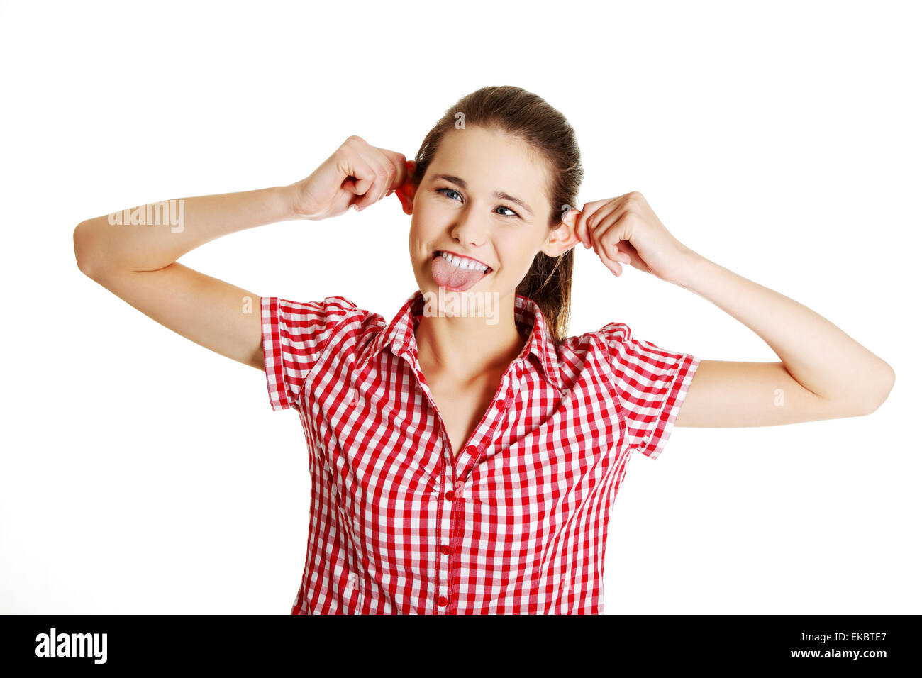 Teen girl making a face to the camera Stock Photo - Alamy