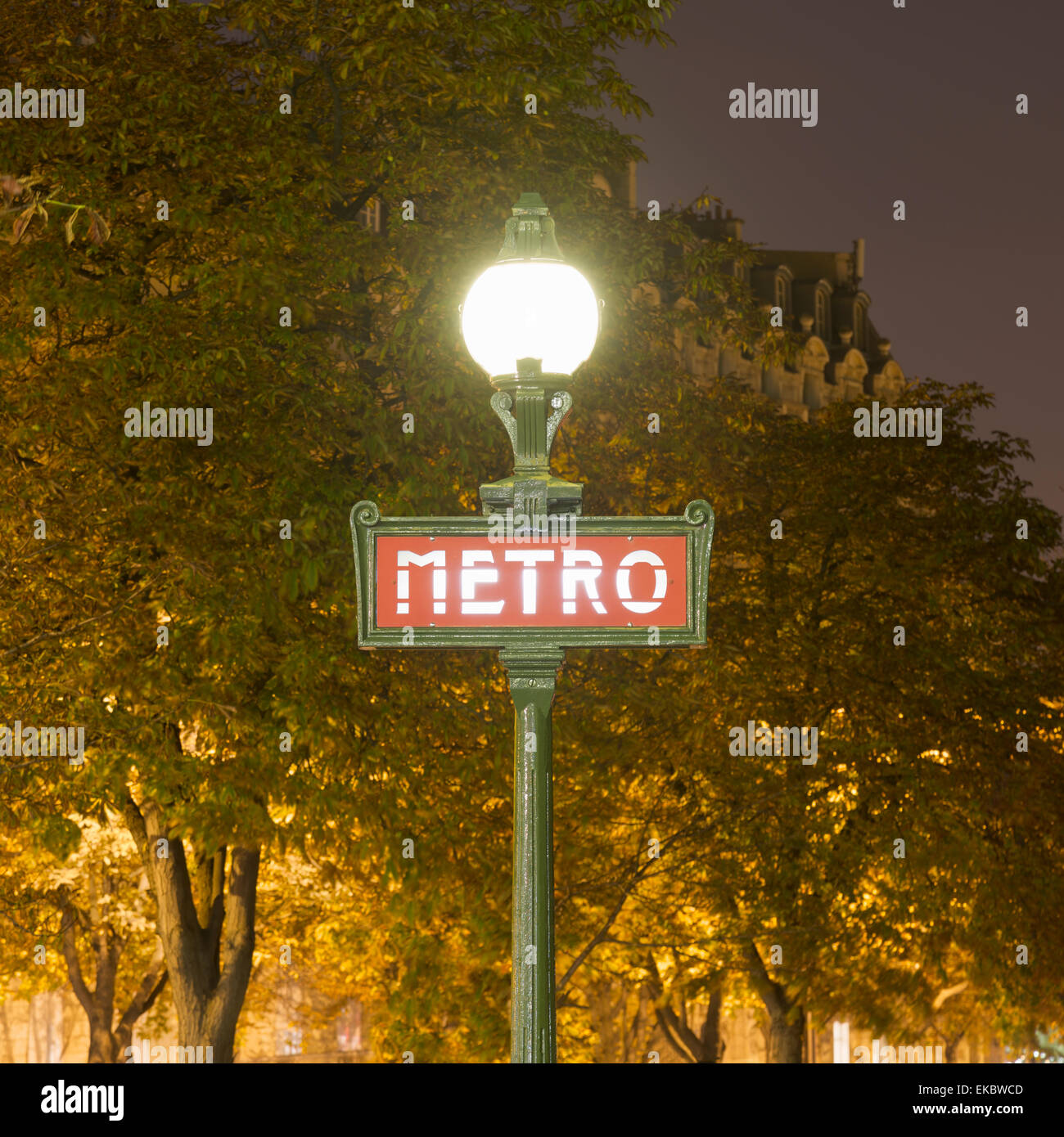 View of street lamp and metro sign at night, Paris, France Stock Photo ...