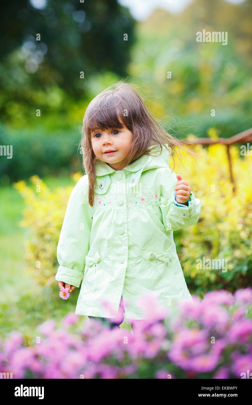 little girl in red making funny face Stock Photo - Alamy