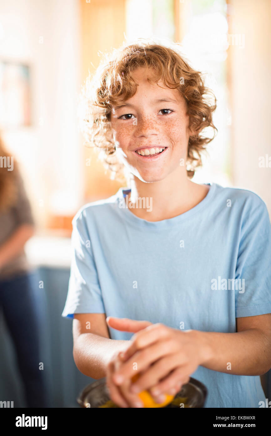 Boy eating an orange hi-res stock photography and images - Alamy