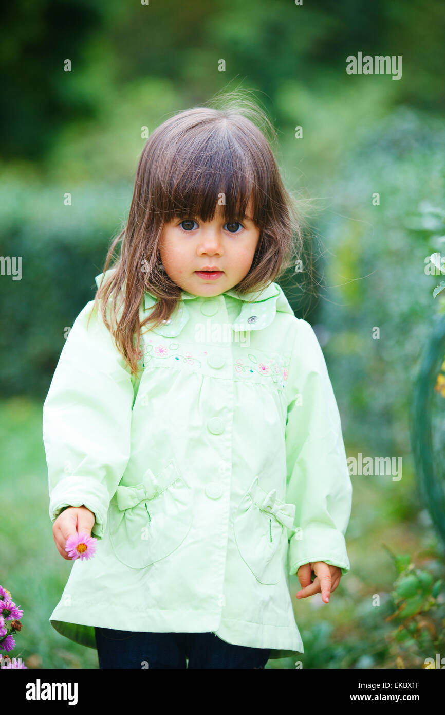little girl in red making funny face Stock Photo - Alamy
