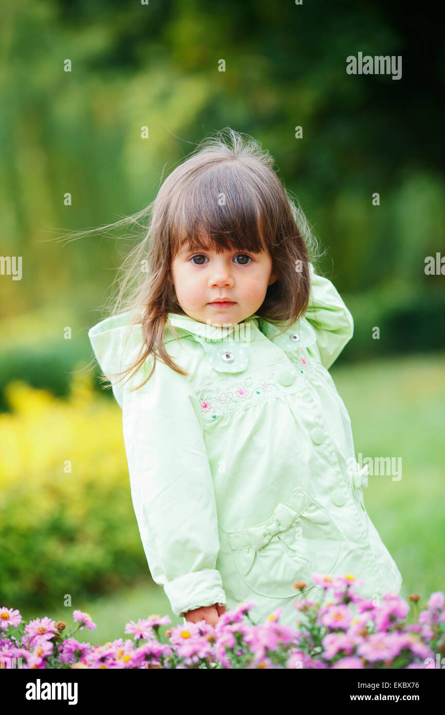 little girl in red making funny face Stock Photo - Alamy