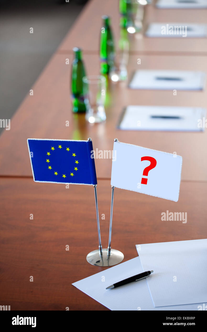 EU flag in a stand on table with second empty flag for your project ...