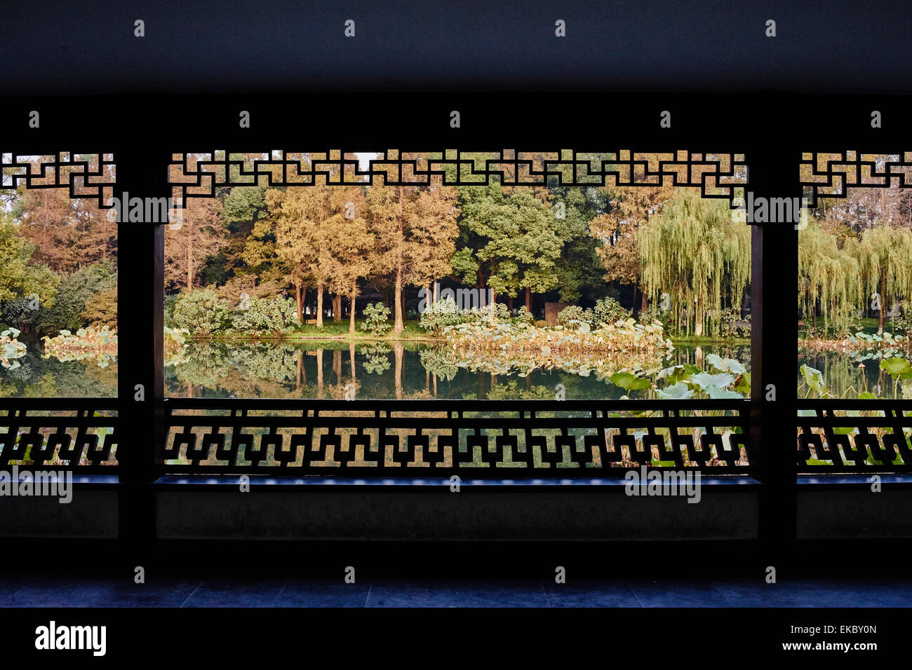 View from silhouetted traditional window on Westlake, Hangzhou, China ...