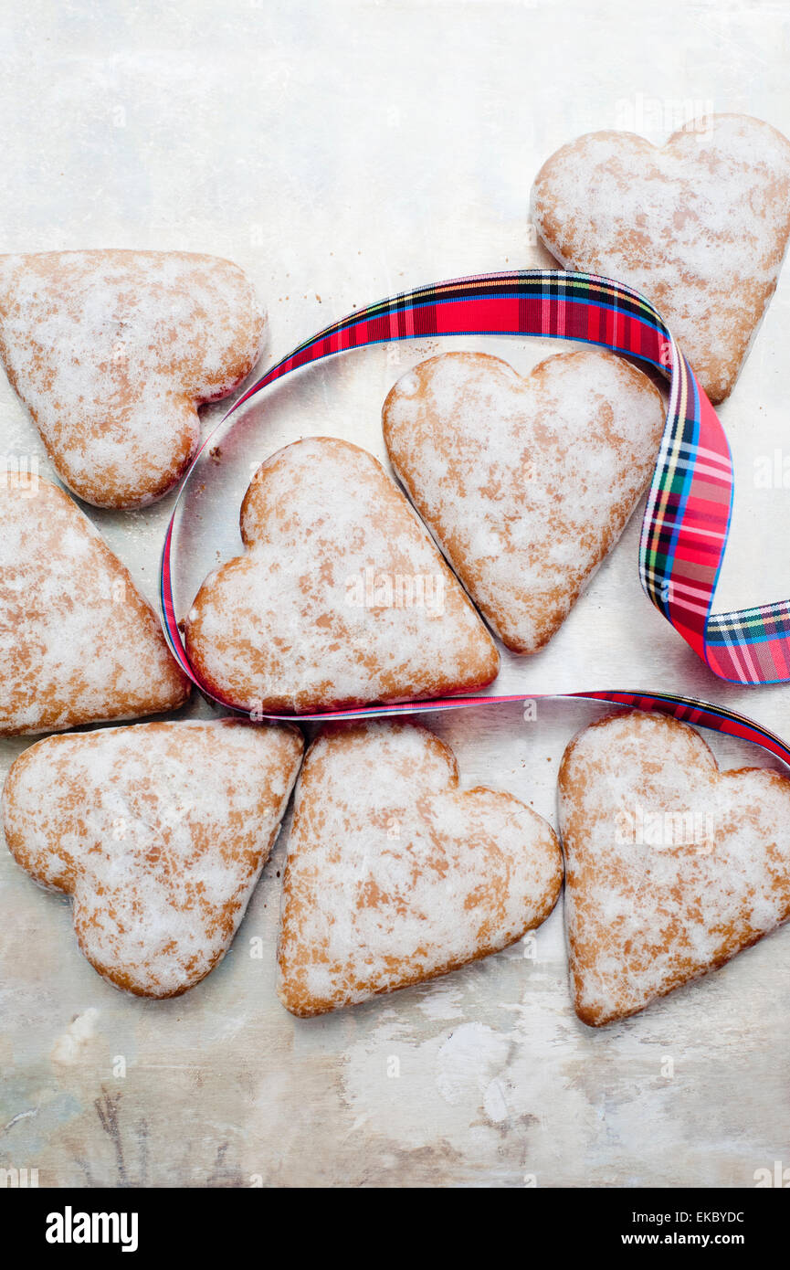 Heart-shaped gingerbread cookies with checkered ribbon Stock Photo - Alamy