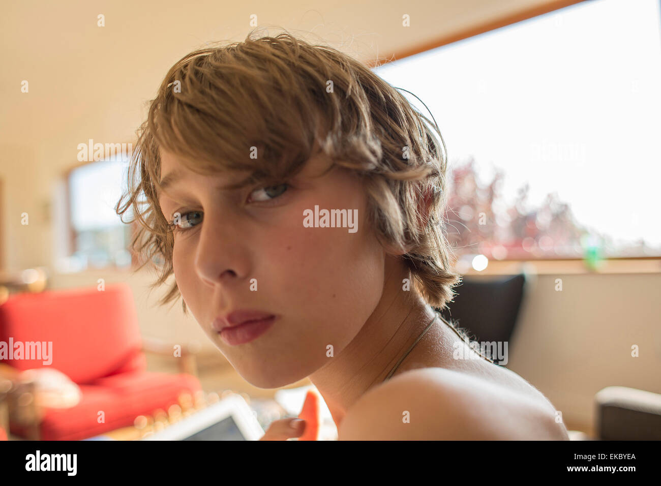Boy at home in living room Stock Photo - Alamy