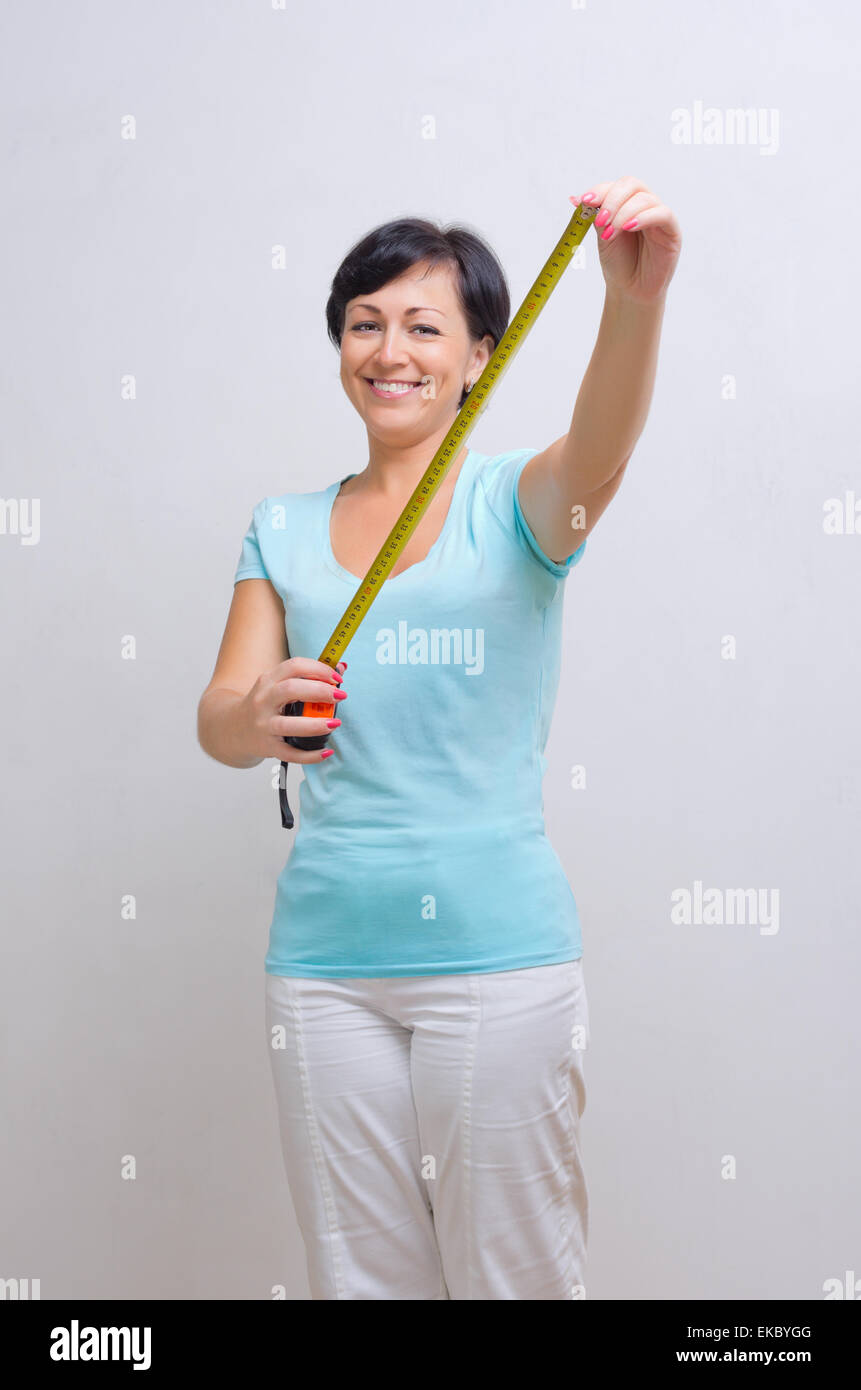 Woman with measurement tape Stock Photo - Alamy