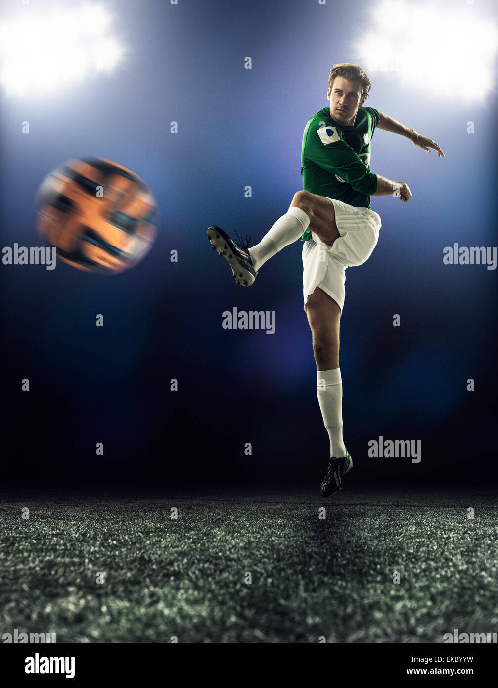 Footballer kicking ball hi-res stock photography and images - Alamy
