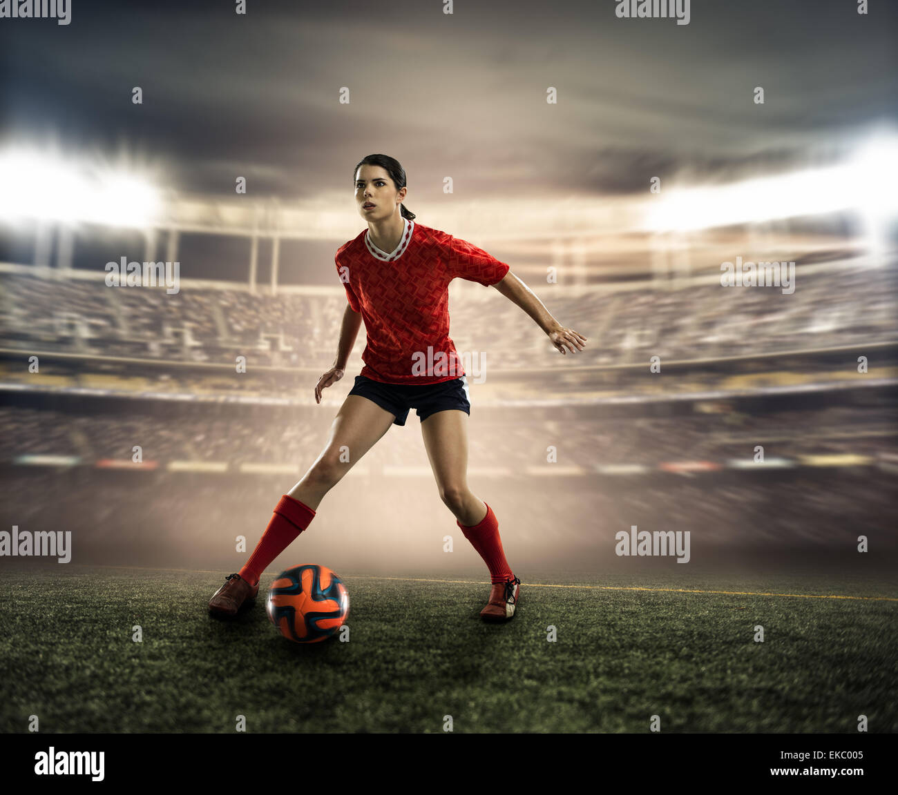 Woman footballer dribbling hi-res stock photography and images - Alamy