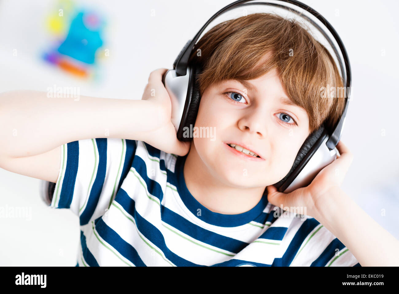 Boy listening to music Stock Photo - Alamy