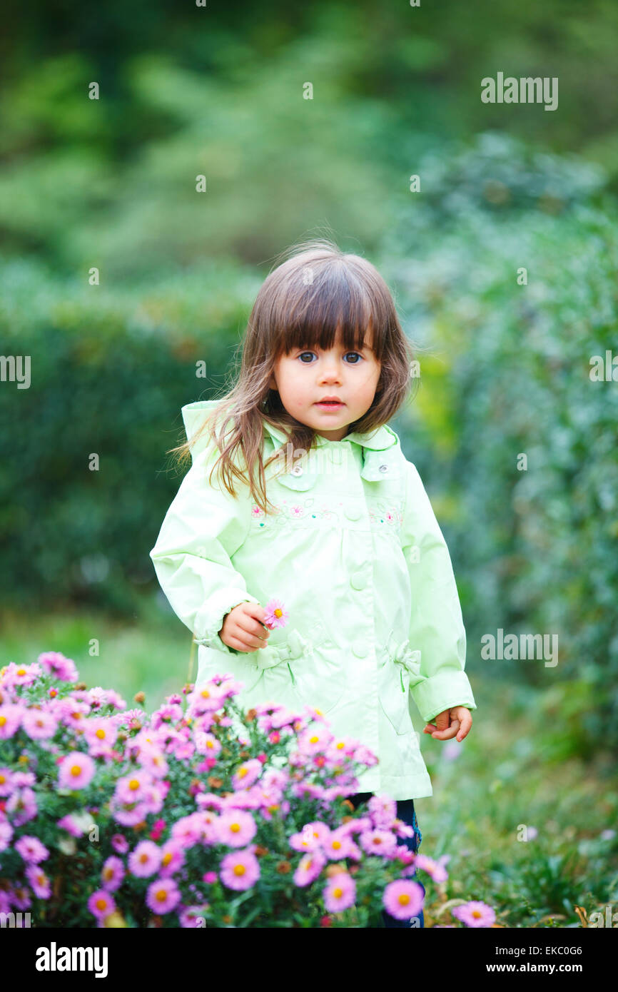 little girl in red making funny face Stock Photo - Alamy