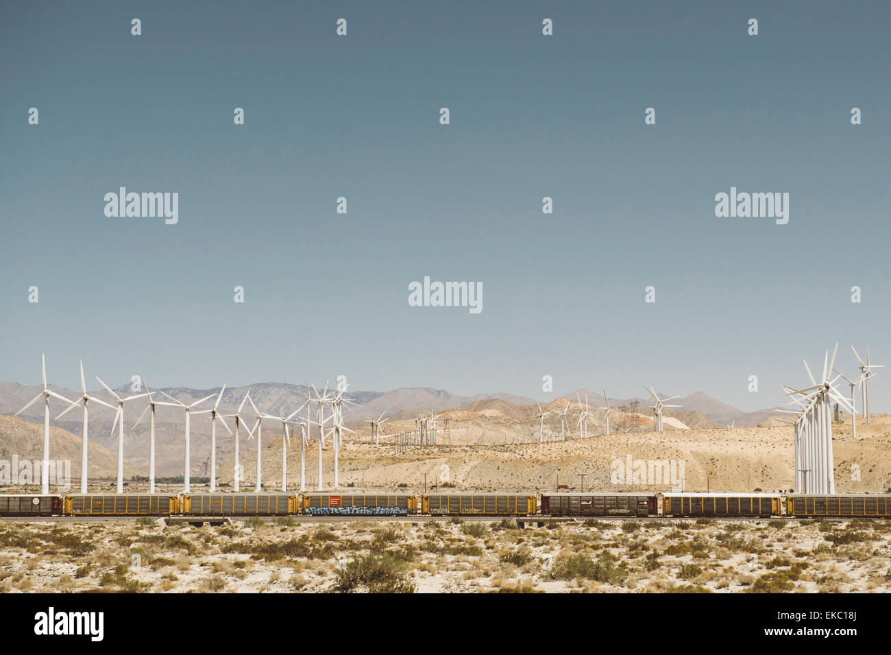 View of freight train in front of wind farm, Palm Springs, California ...