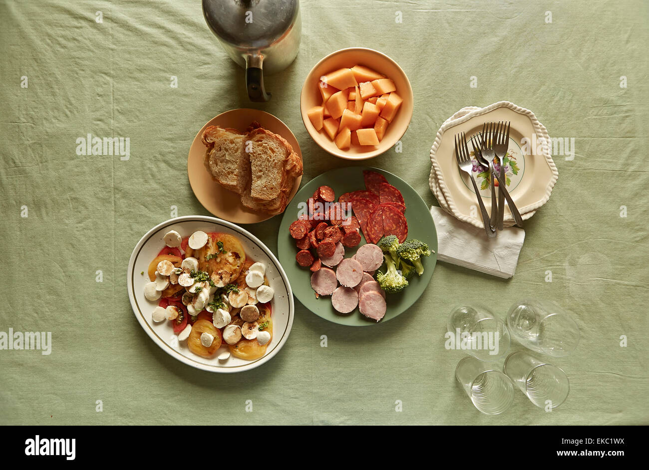Overhead view of plates of food on tablecloth Stock Photo - Alamy