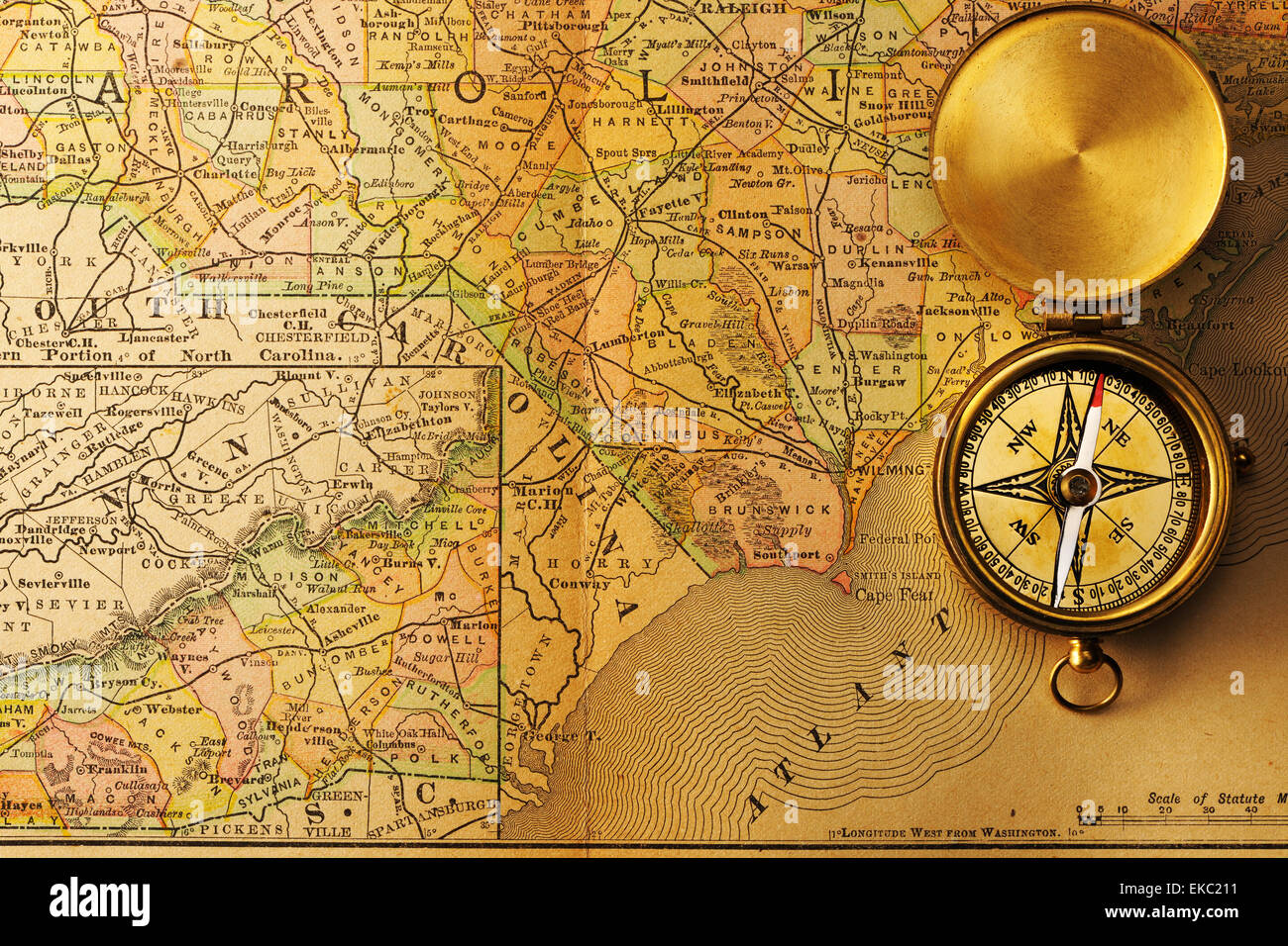 Antique compass over old XIX century map Stock Photo - Alamy