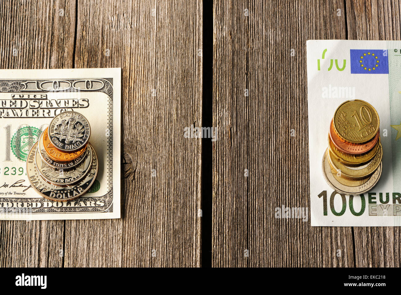 US and euro money over wooden background Stock Photo - Alamy