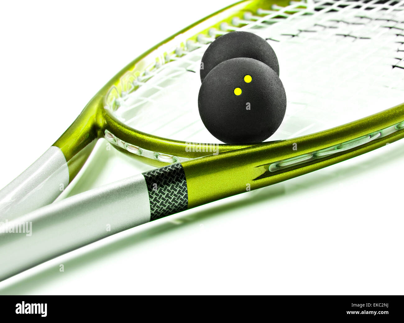 Green and silver squash racket and balls Stock Photo - Alamy