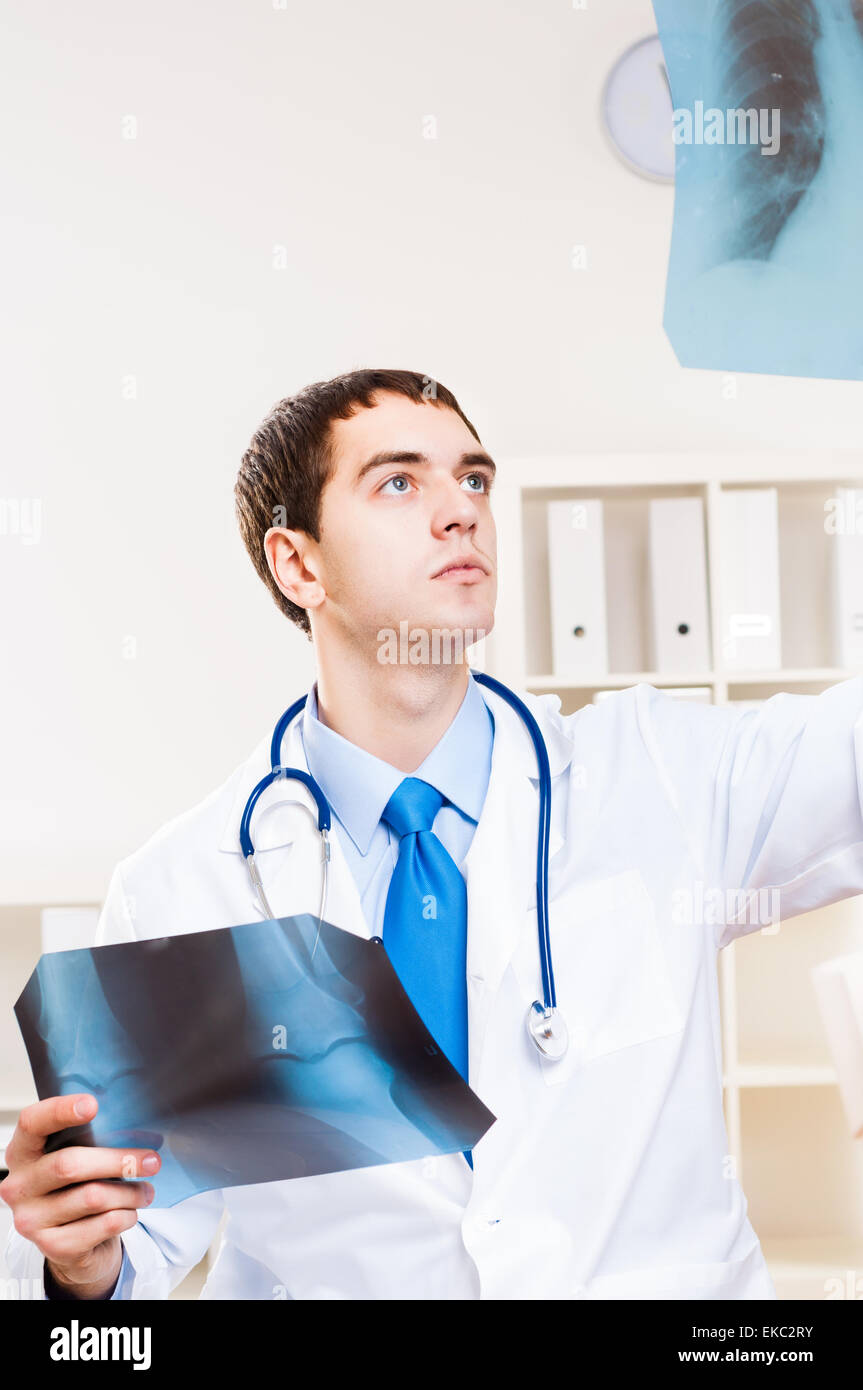 Doctor looking the x-ray Stock Photo - Alamy