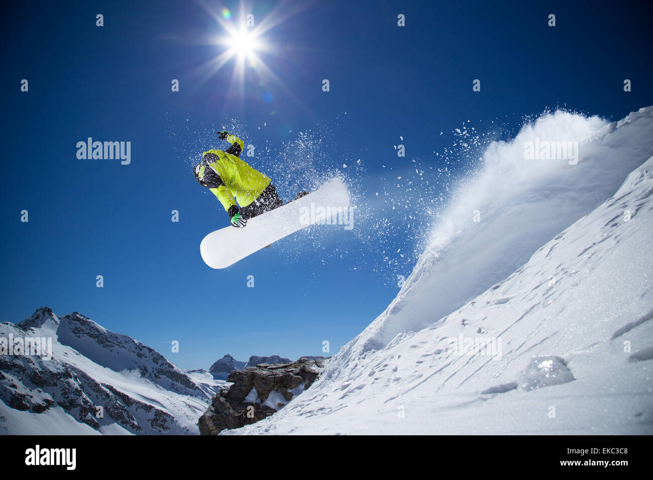 Snowboarder in high mountains during sunny day Stock Photo - Alamy