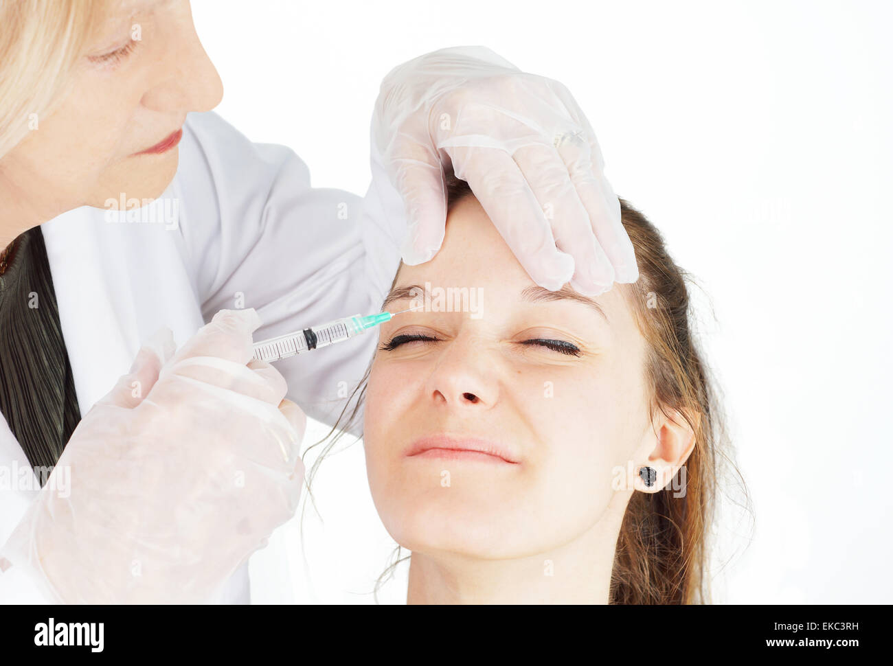 Young woman getting botox in her frown Stock Photo - Alamy