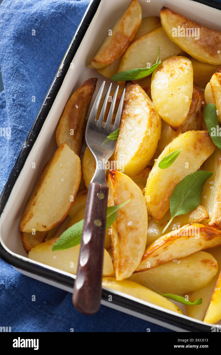 baked potato wedges in enamel baking dish Stock Photo - Alamy