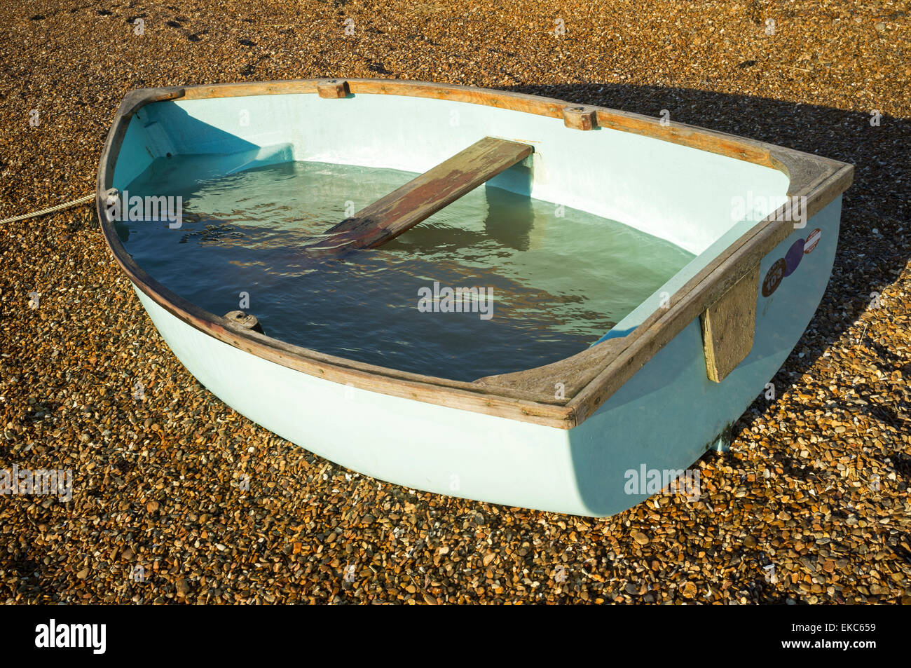 Dingy full of rainwater Stock Photo - Alamy