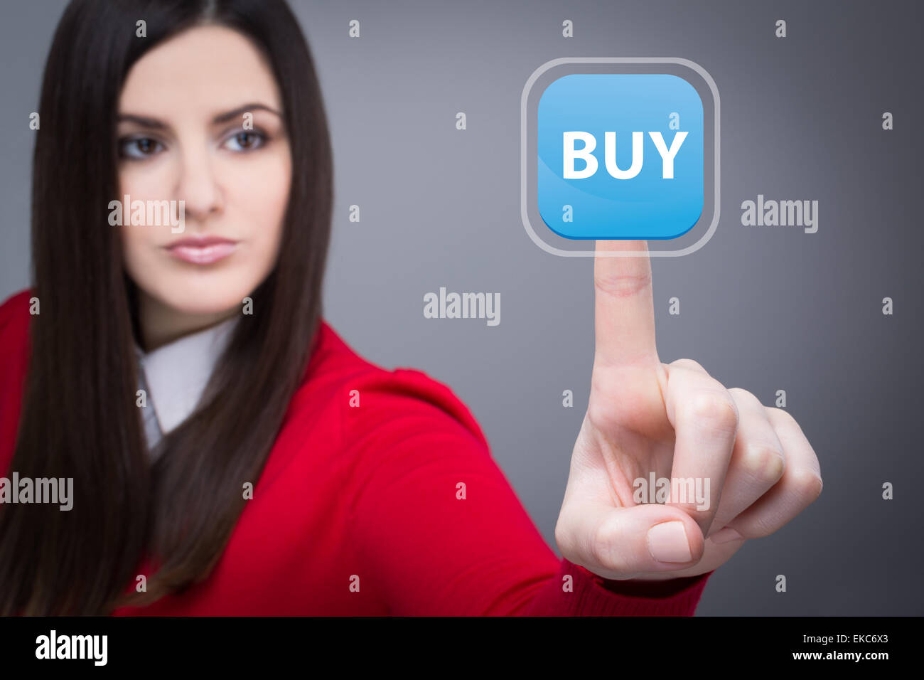 Businesswoman clicking buy button Stock Photo - Alamy