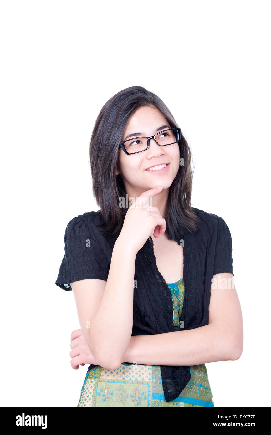Smart looking young biracial teen girl looking upward with smili Stock ...