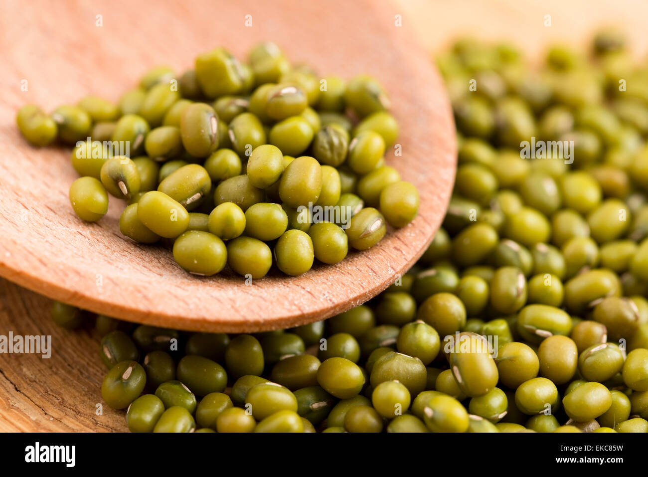 Mung beans over wooden spoon Stock Photo - Alamy