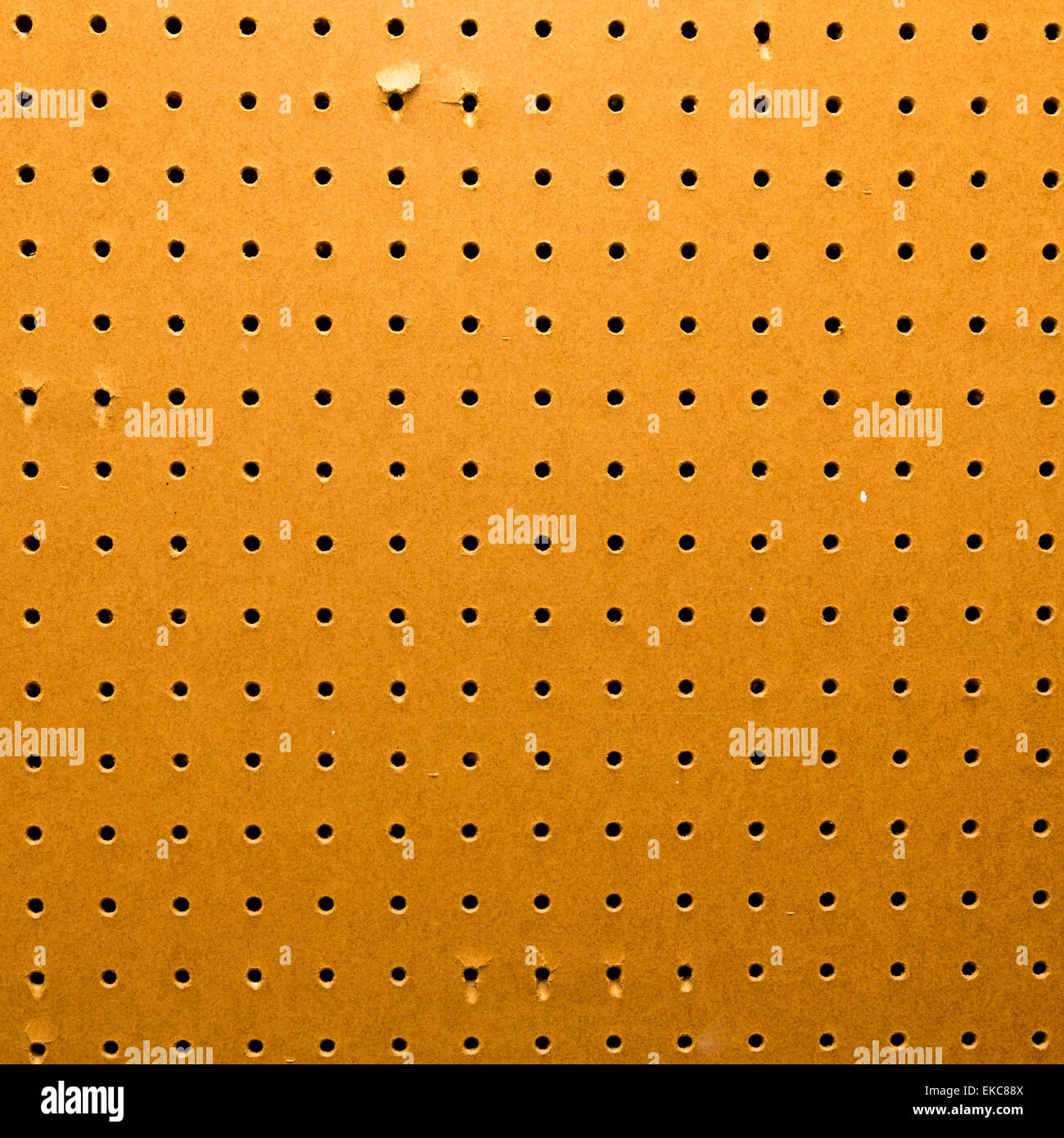 Peg board texture closeup Stock Photo - Alamy