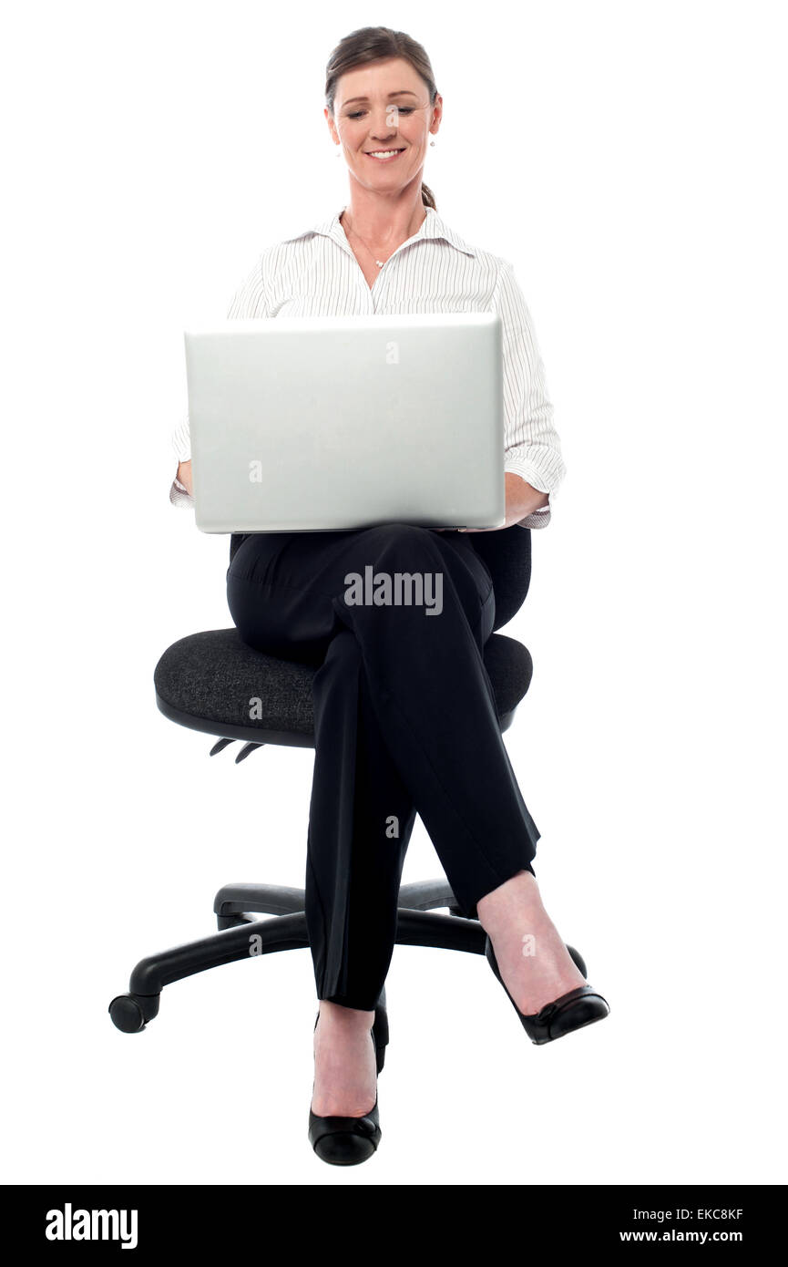 Corporate lady working on her laptop Stock Photo - Alamy