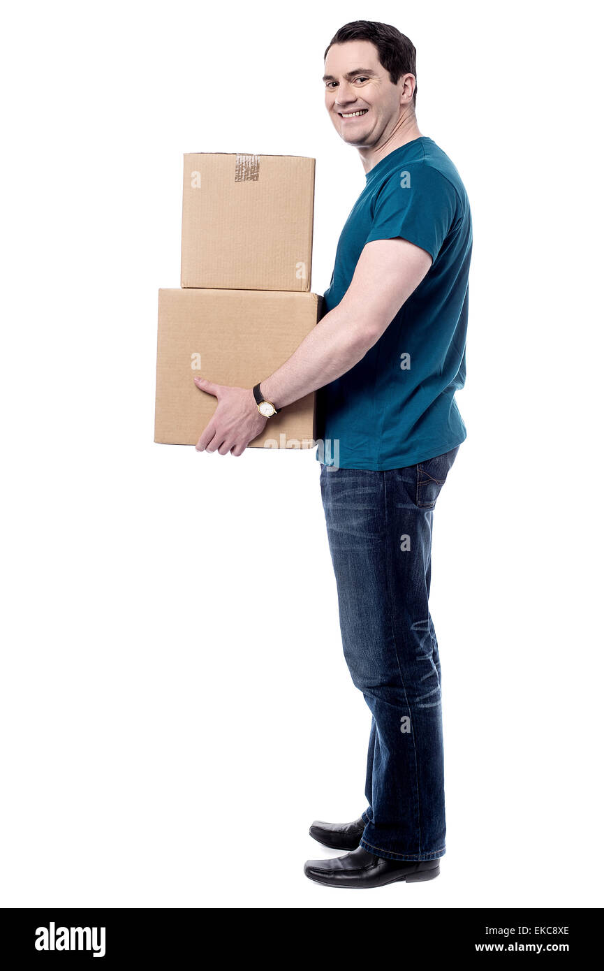 Parcel delivery man carrying Cut Out Stock Images & Pictures - Alamy