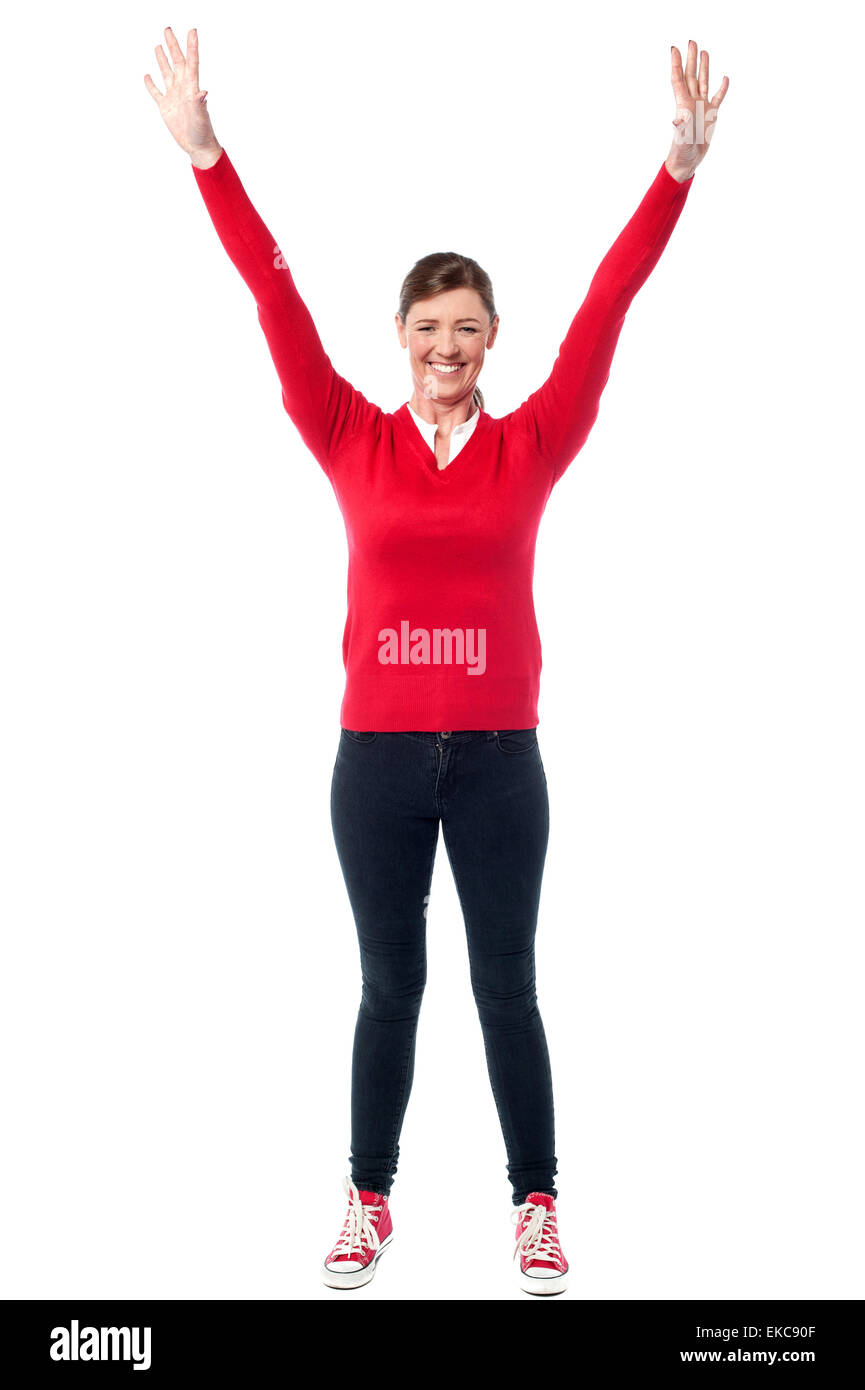Excited woman raising arms celebrating hi-res stock photography and ...