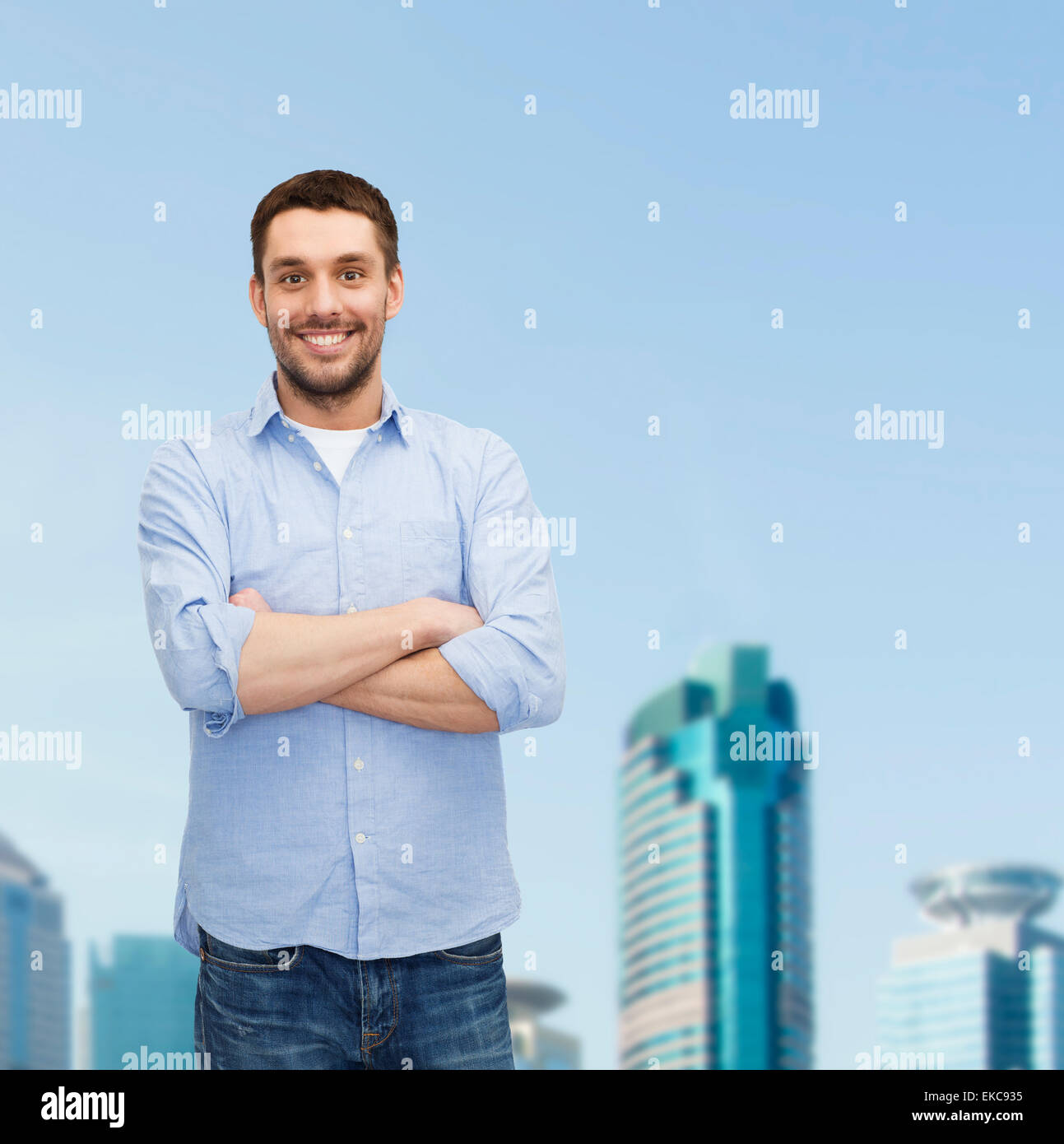 smiling man with crossed arms Stock Photo - Alamy