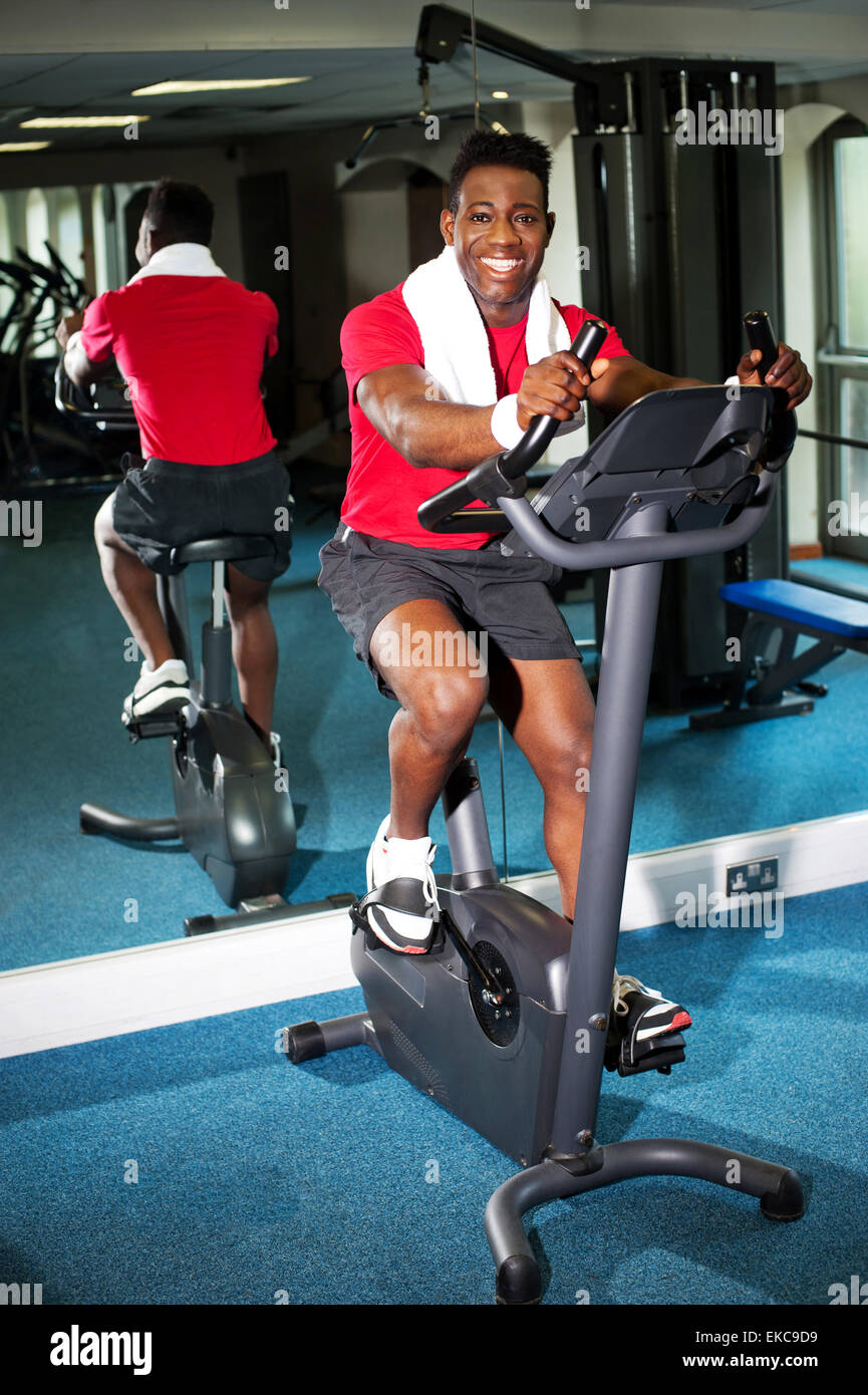 Athletic young man at the gym Stock Photo - Alamy